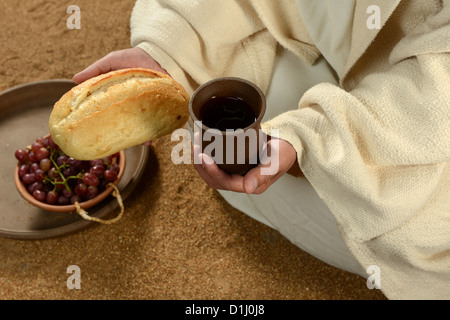 Jesus hands holding bread and grapes, symbols of communion Stock Photo ...