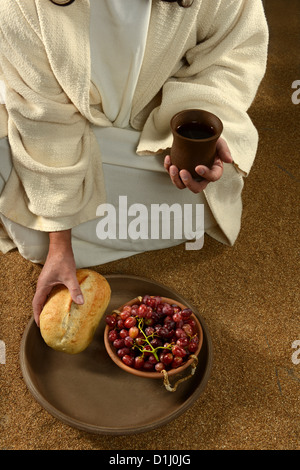 The hands of Jesus offering the Communion wine and bread Stock Photo ...