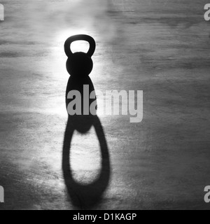 Crossfit Kettlebell weight backlight and shadow on the gym floor Stock ...