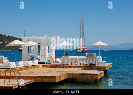 Overwater beach platform for sunbathing and swimming. Torba village ...