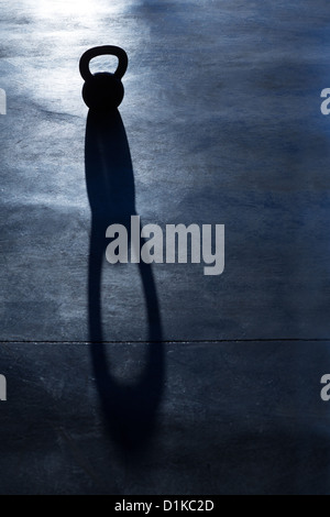 Crossfit Kettlebell weight backlight and shadow on the gym floor Stock ...