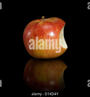 apple with missing part in black reflective back. Looks a little bit ...