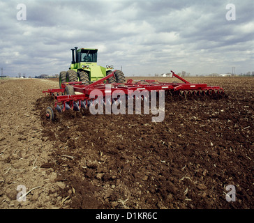 Farmer disking a field Stock Photo - Alamy