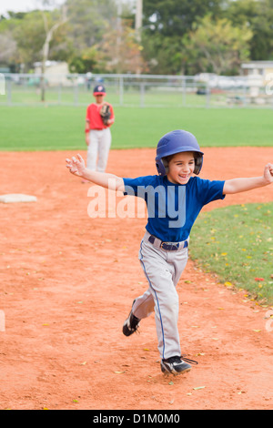 Hispanic baseball player running on field Stock Photo - Alamy