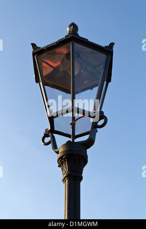 old Berlin gas lantern in front of the modern hotel complex One Berlin ...