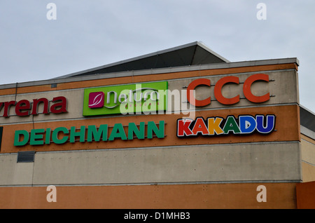 Advertisements on the wall of Carrefour supermarket, brands logos, ads ...