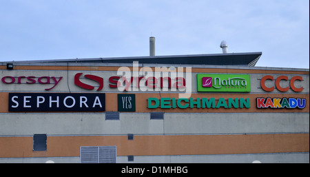 Advertisements on the wall of Carrefour supermarket, brands logos, ads ...