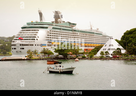A cruise ship docked at Pointe Seraphine premier duty-free shopping ...