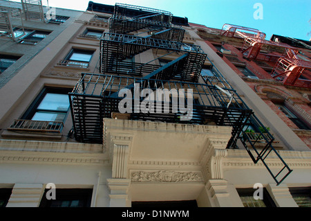 Fire escapes on tenement apartment buildings in Harlem neighborhood ...