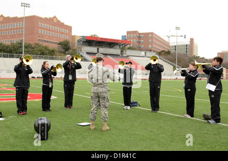 Staff Sgt. Becky McLaughlin conducts the U.S. All-American Band at ...