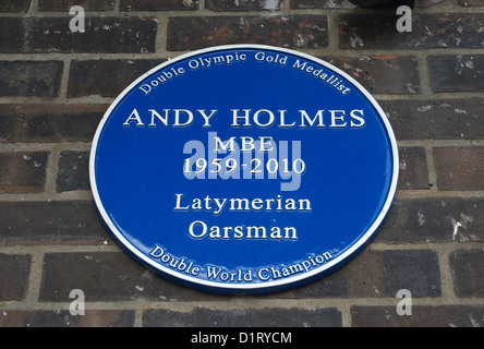 A blue plaque commemorating Andy Holmes MBE, on a boathouse in Upper ...