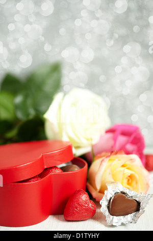 Valentine day composition: sweet candy, with gift boxes with bow and ...