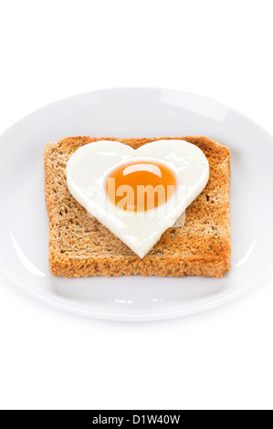 Valentine's day breakfast concept. Valentines fried eggs in the shape of a heart, coffee with ...