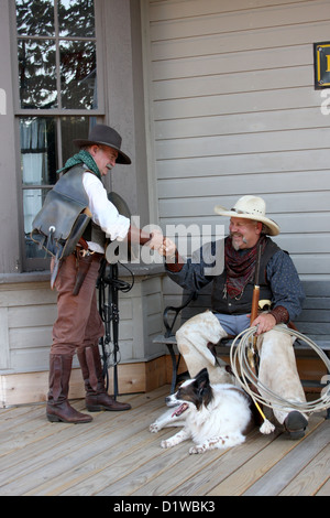 Two cowboys greeting with a handshake Stock Photo: 52803709 - Alamy
