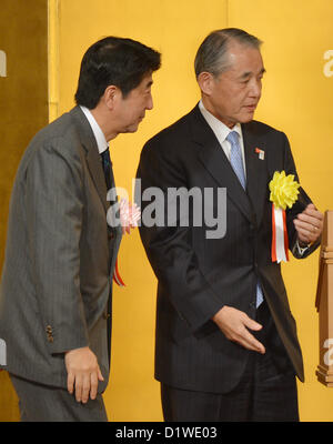 Japan's new economic revitalization minister Shigeyuki Goto (far R ...