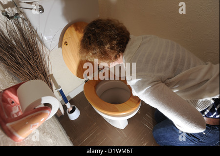 Woman suffering from Norovirus, better known as the winter vomiting bug ...