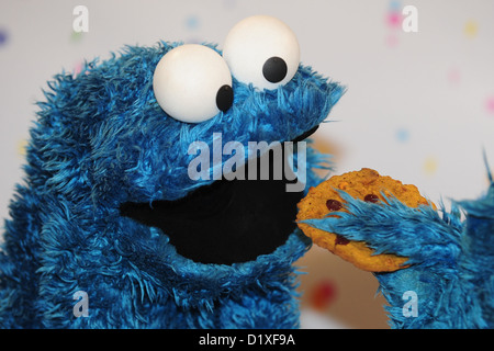 Sesame Street Muppet Cookie Monster poses for photographs during a ...