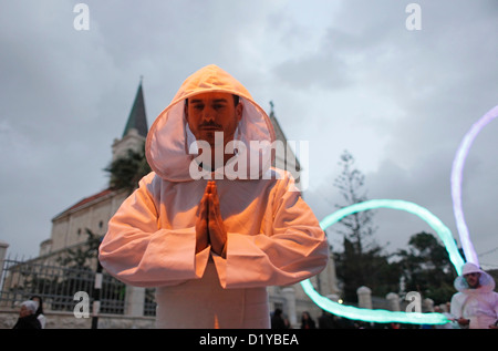An Israeli-Arab Christian man dressed as a monk takes part in the ...