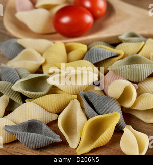 close up of raw italian pasta in plate on table Stock Photo - Alamy