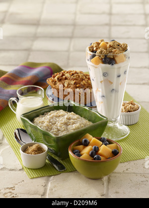 Healthy vegetarian breakfast with oatmeal, yogurt and persimmon. Studio ...