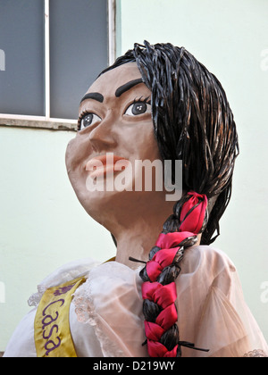 traditional folk art los gigantes figure with pink ribbons in her ...
