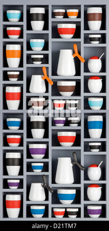 White cups on the shelf in the store. White ceramic coffee cups and ...