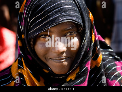 Portrait of a veiled smiling afar tribe girl with sharpened teeth, Afar ...