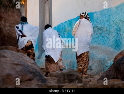Harari women walking in the street wearing colourful clothing. Harar ...
