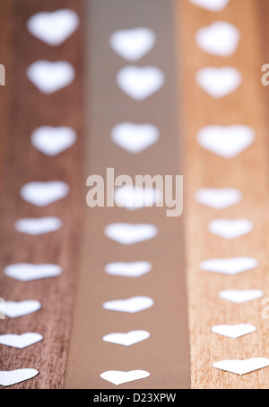 Heart shape papper cuts on a background studio shot Stock Photo - Alamy