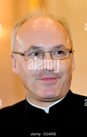 New bishop of Regensburg, Rudolf Voderholzer, stands next to his ...