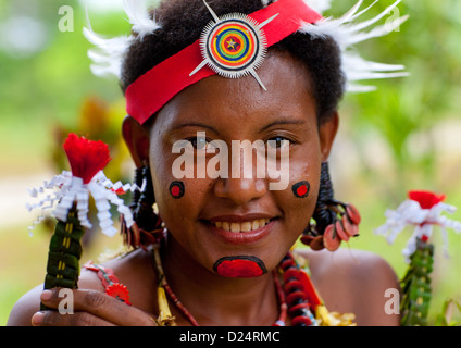 Trobriand Island woman in traditional attire carrying yam basket ...