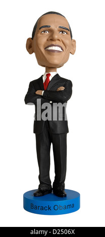 A bobble head doll of Barack Obama is for sale at a souvenir shop in ...