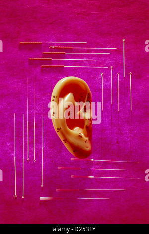 Acupuncture Needles, Ear Model And Chinese Herbs Stock Photo - Alamy