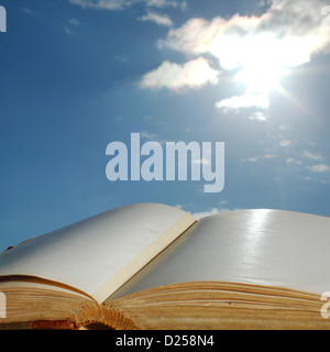 book of wisdom on sun sky background Stock Photo - Alamy