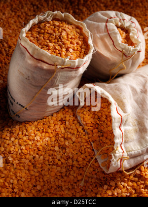 Entire frame red split lentils with sacks Stock Photo - Alamy