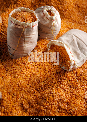 Entire frame red split lentils with sacks Stock Photo - Alamy