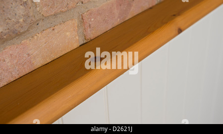 Pine baton on top of painted tongue and groove panelling in a newly ...