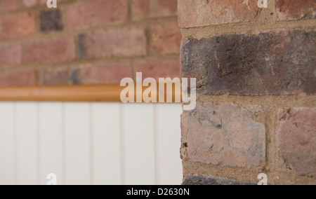 Pine baton on top of painted tongue and groove panelling in a newly ...