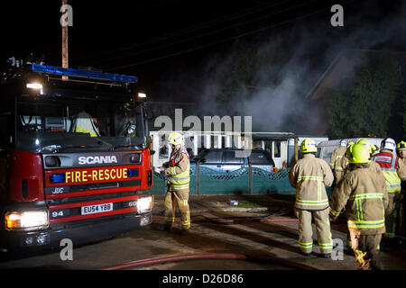 Firefighters tackling a blaze at a bungalow that caught fire after the ...