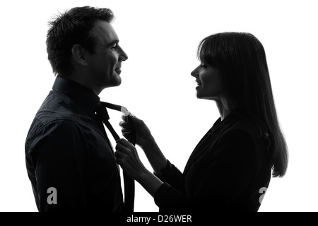 Man in silhouette tying up his rowboat at sunset. Copy space Stock ...