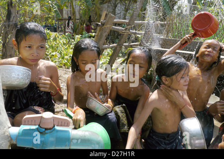 Cambodia - children washing at well Stock Photo - Alamy
