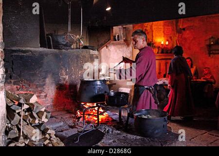 medieval cooking area, cooks in medieval clothing, medieval decorated ...