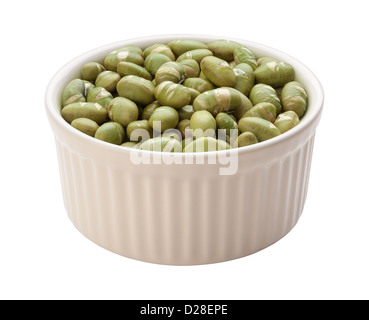 A closeup shot of a single pod of dry green bean hanging on a tree ...