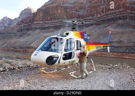 passengers boarding papillon helicopter tours on helipad at Grand ...