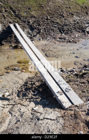 two planks crossing over a ditch Stock Photo: 24180789 - Alamy