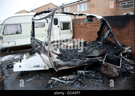 Burnt out touring Caravan Arson Fire UK Stock Photo - Alamy