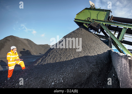 Mine worker with helmet and full body coal dust Stock Photo - Alamy