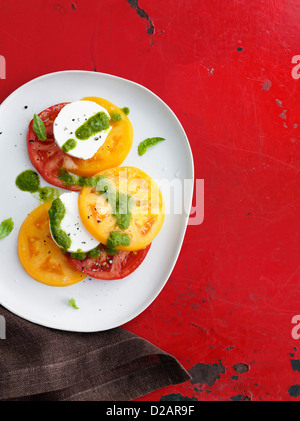 Still life of delicious caprese salad on black background Stock Photo ...