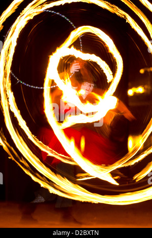 Fire spinners using fire hula hoops Stock Photo - Alamy