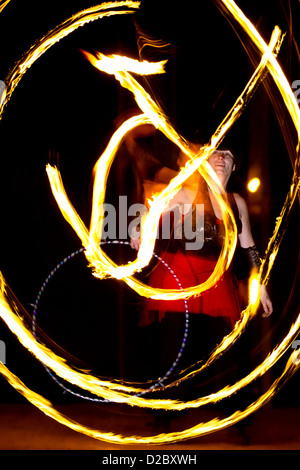 Fire spinners using fire hula hoops Stock Photo - Alamy